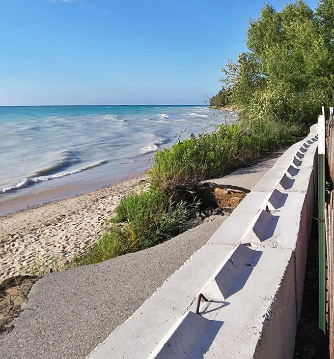 Beachfront engineering – this seawall path offers prime viewing of Christmas Cove's stunning aquatic display without getting sandy.