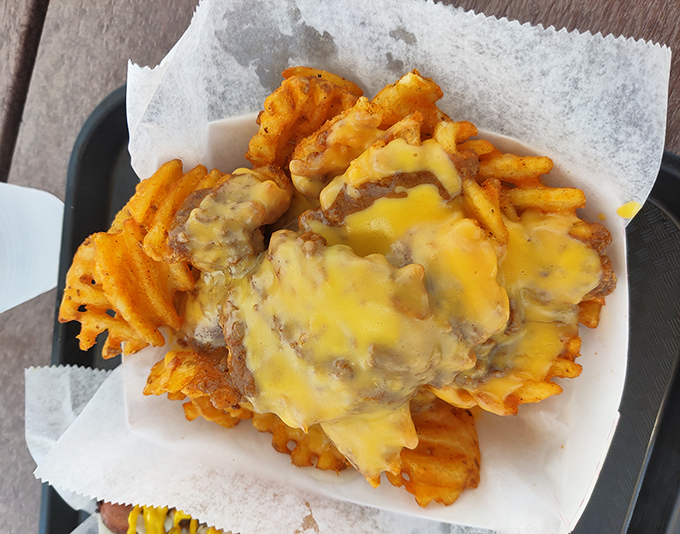 Waffle fries smothered in melty cheese &ndash; because sometimes a side dish deserves to be the main event in your mouth.