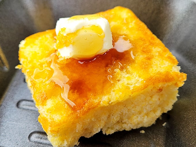 Cornbread so perfect it makes Southern grandmothers nod in approval – golden, buttery squares that straddle the sweet-savory divide with grace.