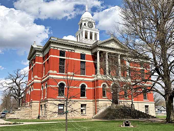 The stately red brick courthouse anchors the town square, its white dome and columns standing proud against Michigan's ever-changing skies.