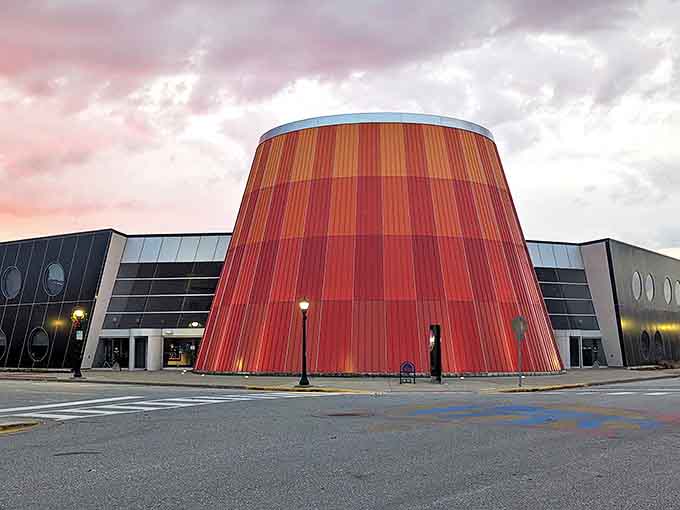 The Delta College Planetarium's distinctive red cone glows at sunset &ndash; an architectural exclamation point in downtown that houses the universe inside.