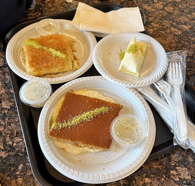 A trio of syrup-soaked delights awaits on simple plates &ndash; proof that sometimes the most unassuming presentations hide the most extraordinary flavors.