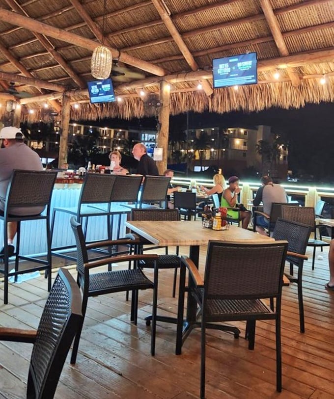 Under the thatched roof, conversations flow as easily as the water surrounding the deck, with every table enjoying that magical "vacation time" feeling.