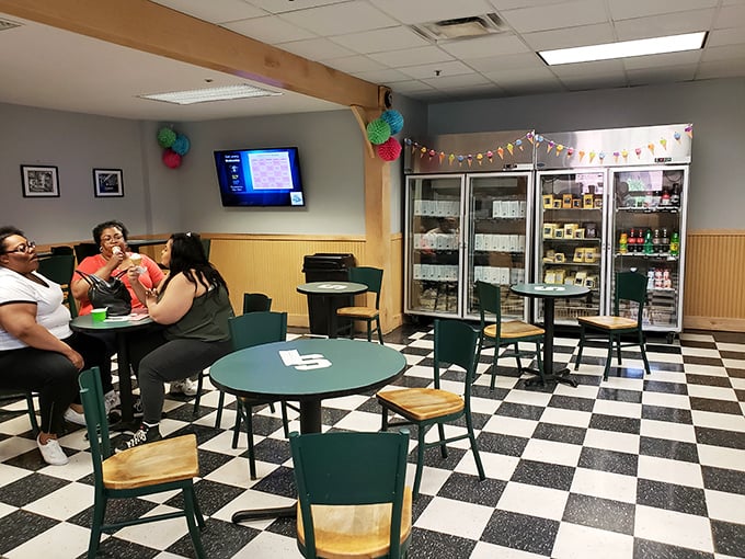 Students gather at green tables, solving the world's problems one spoonful at a time in this campus gathering spot.