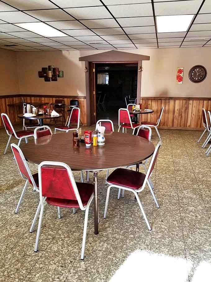 The dining area's unpretentious charm invites conversation and lingering – these tables have supported countless elbows and satisfied sighs.