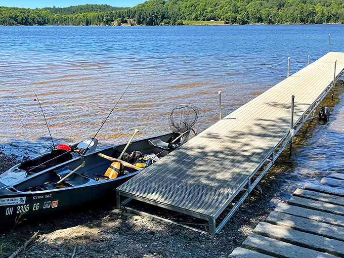 Fishing gear waits patiently on the dock &ndash; a silent invitation to slow down and embrace lake life's simple rhythms.