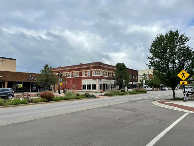 Corner buildings anchor downtown intersections, their architectural details revealing craftsmanship from an era when buildings were built to impress.