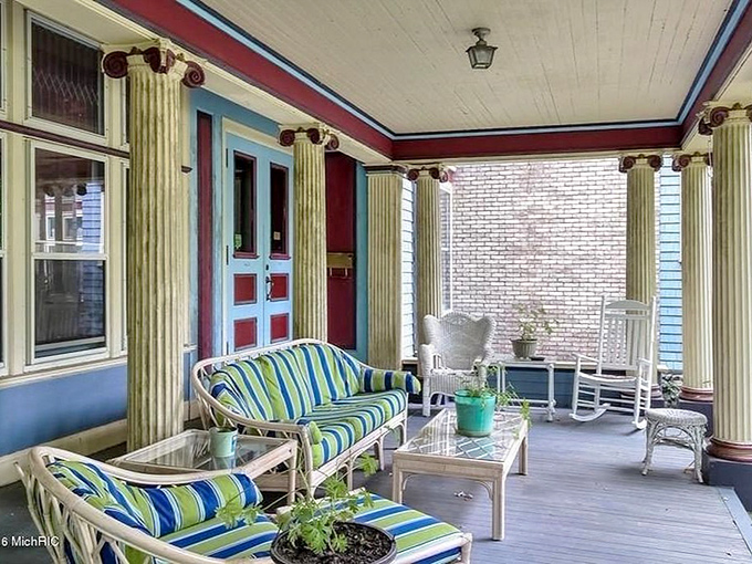 Classic wicker furniture with striped cushions, the perfect stage for your "I'm on vacation" social media humble-brag.