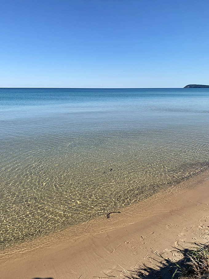 Good Harbor's pristine shoreline curves gently around crystal waters, creating a natural sanctuary that feels worlds away from everyday life.