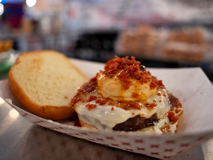 Not just any cheeseburger, but a towering masterpiece where bacon and special sauce create a flavor explosion worthy of the festival's name.