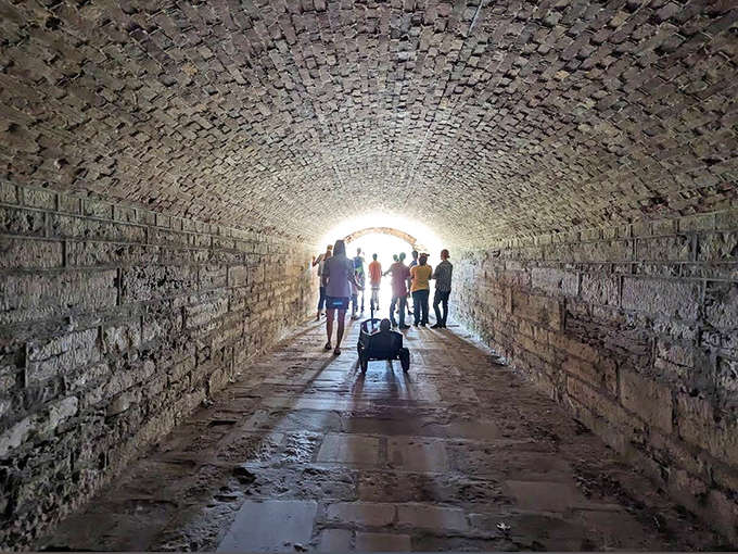 These tunnel passages draw visitors into an underground world of brick archways and echoing footsteps, like something from an adventure movie without the special effects budget.
