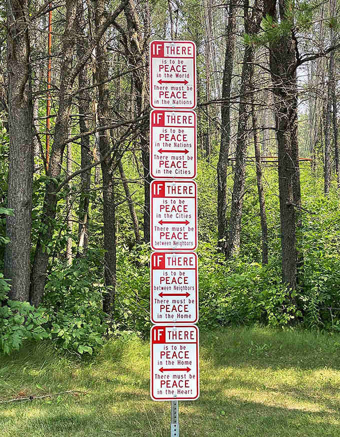 Peace begins within and radiates outward – these stacked signs offer a roadmap from personal tranquility to global harmony.