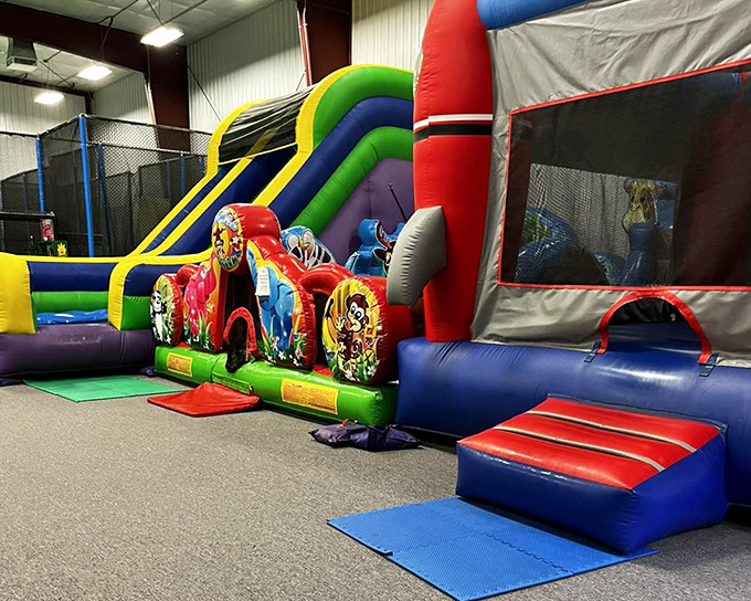 The inflatable park's vibrant colors and whimsical designs promise adventures that look deceptively easy until you're halfway through, sweating profusely.