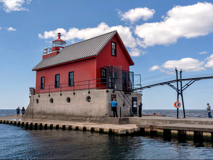 The charming red inner lighthouse building sits firmly on its concrete foundation, ready to withstand another century of Michigan weather.
