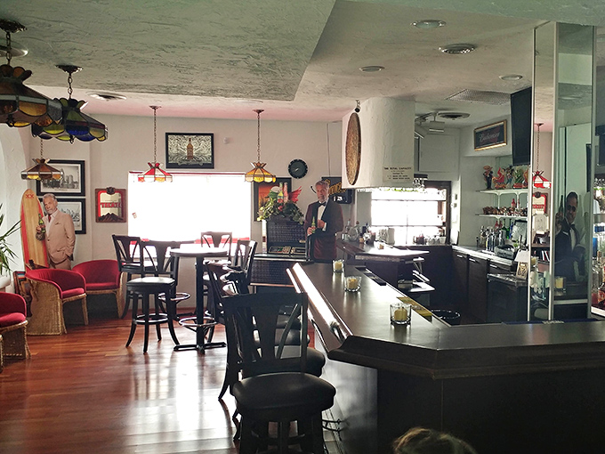 The bar area glows with warm lighting and colorful decor, beckoning patrons to unwind with a margarita after navigating Detroit traffic.
