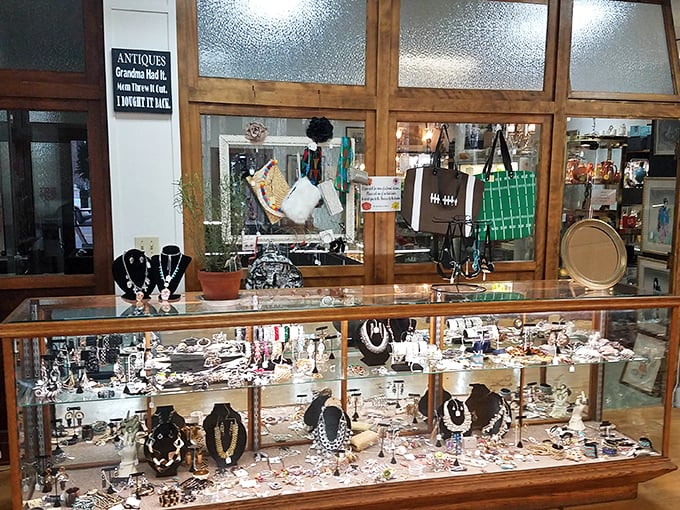 Vintage jewelry sparkles under display lights, each piece whispering stories of special occasions, romance, and fashion statements from bygone eras.