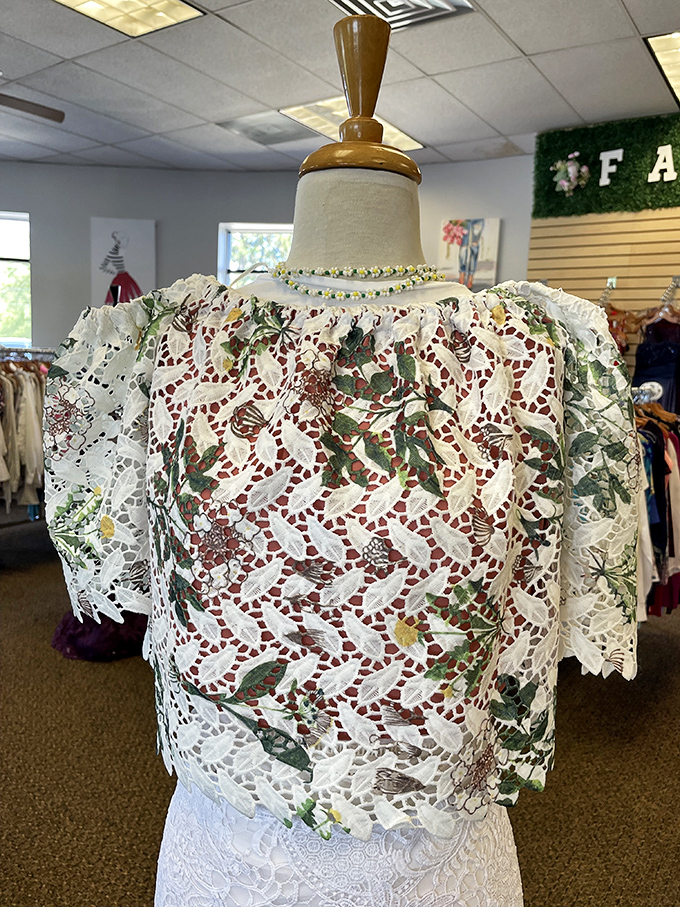 This intricate lace blouse whispers tales of garden parties past while promising future compliments for its lucky new owner.