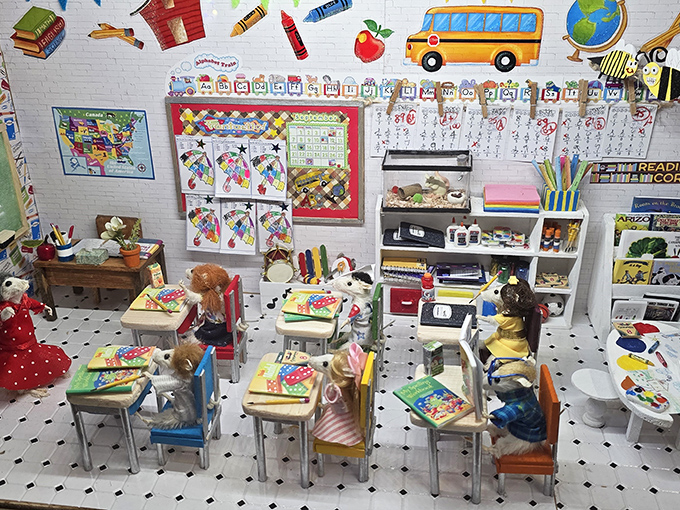 The classroom diorama features meticulous details down to the tiny arithmetic problems on those impossibly small desks.