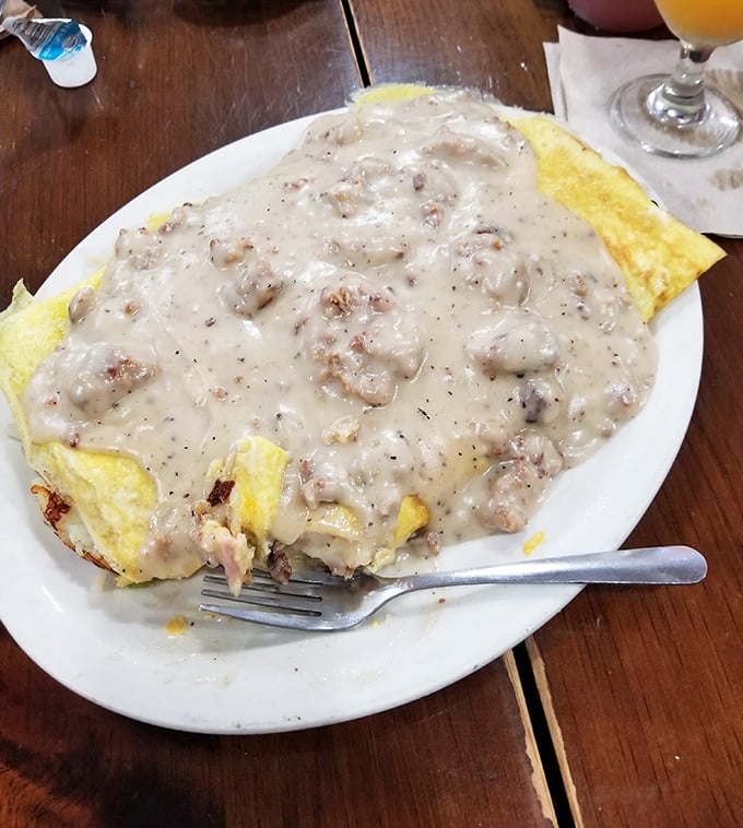 Breakfast meets comfort food in this omelet smothered in creamy sausage gravy &ndash; the kind of dish that demands a nap afterward.