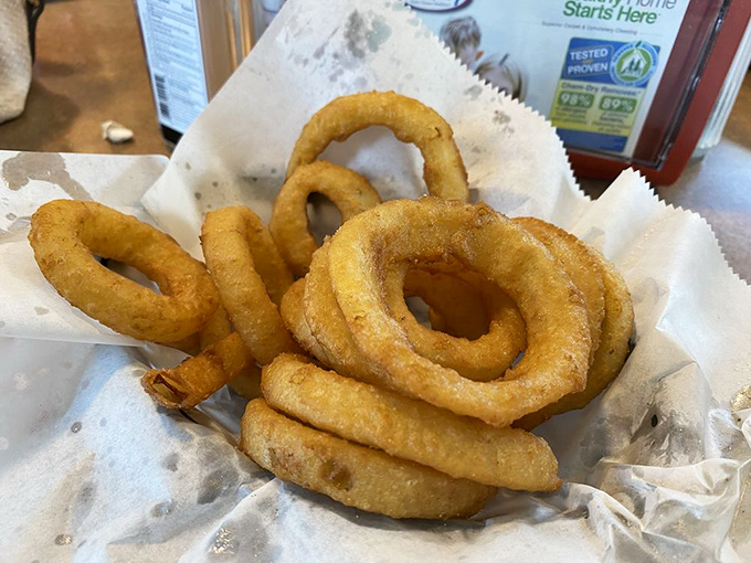 Golden, crispy onion rings that shatter satisfyingly with each bite – the perfect sidekick to Schlenker's legendary burgers.