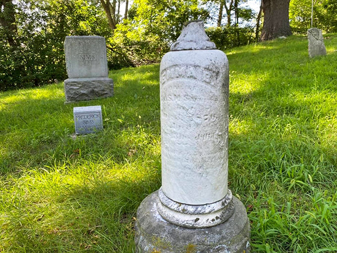 Towering pillar monuments reach skyward with classical elegance, like architectural exclamation points marking lives well lived and fondly remembered.