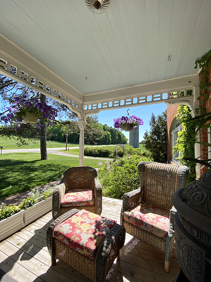 Porch View: Morning light streams through ornate porch details, creating the perfect spot to savor coffee while watching the world wake up.