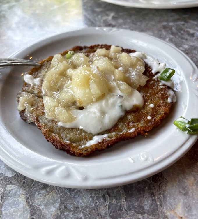 Crispy on the outside, tender within &ndash; these potato pancakes with applesauce and sour cream create a sweet-savory symphony.