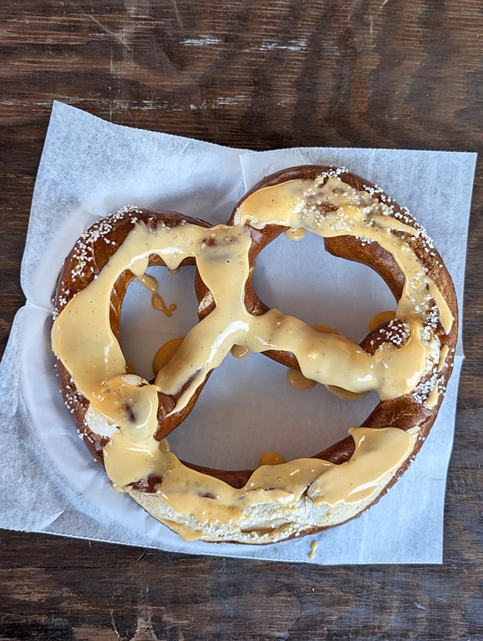 This isn't just any pretzel &ndash; it's a soft, chewy canvas for beer cheese that's practically performing a cabaret on your taste buds.