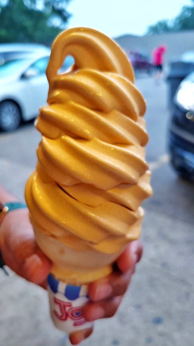 Golden swirls of pumpkin soft serve signal fall's arrival, a seasonal treat that tastes like autumn sunshine in frozen form.