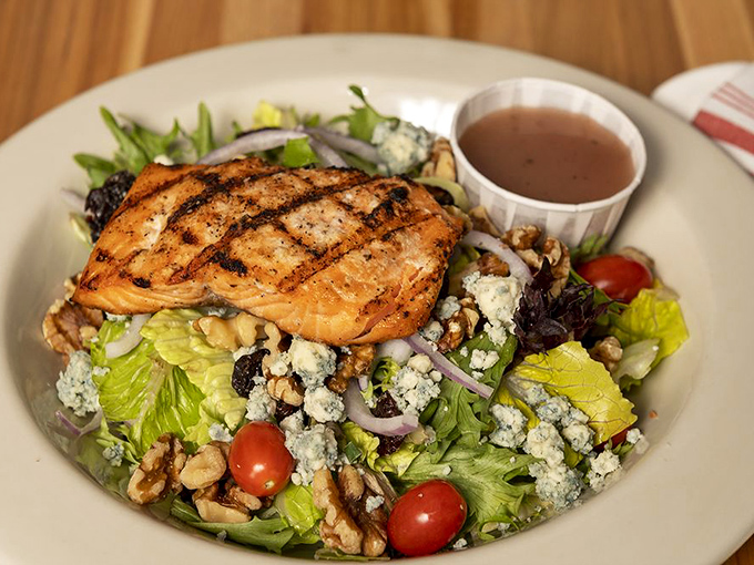 Grilled salmon crowns this vibrant salad like royalty, proving healthy choices can still feel luxurious.