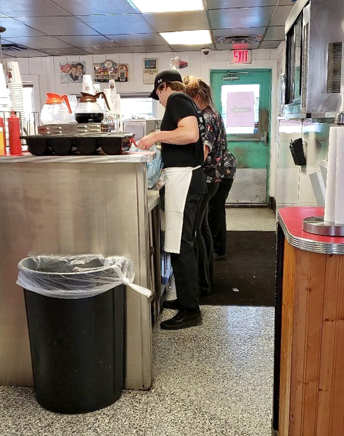 The heart of Don's kitchen team works with the synchronized precision of people who've turned burger-flipping into an art form worthy of the Louvre.