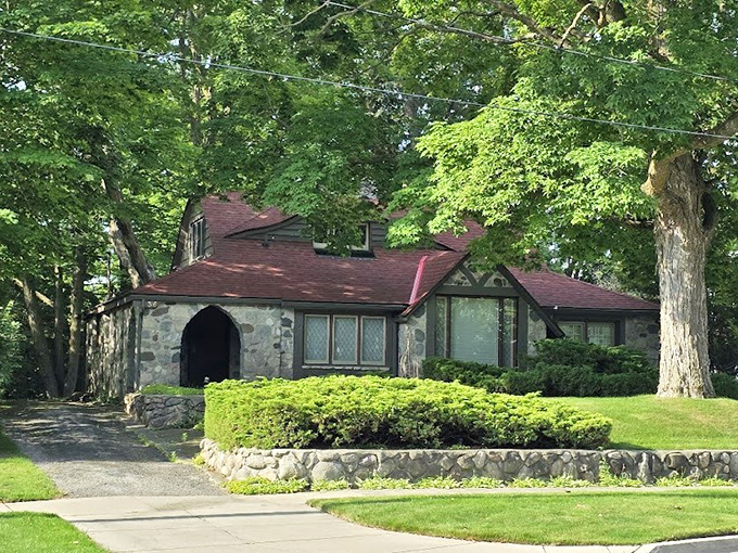 The arched entryway creates a moment of transition, as if you're stepping through a portal between the ordinary world and Young's stone fantasy.