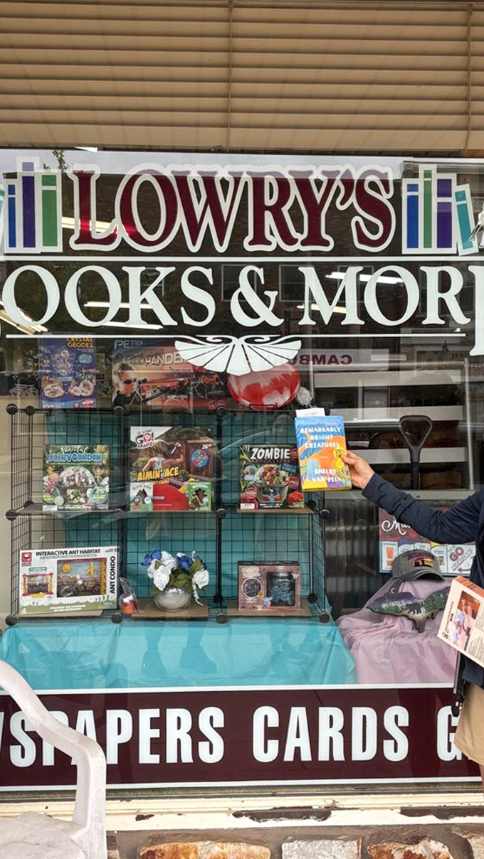 The window display showcases an eclectic mix of books, games, and curiosities, a tantalizing preview of wonders inside.