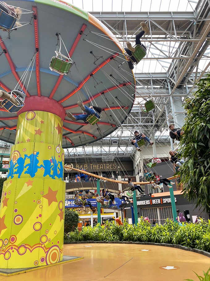 The swing ride lifts little daredevils high above the park floor, creating that perfect mixture of delight and "maybe this wasn't such a good idea."