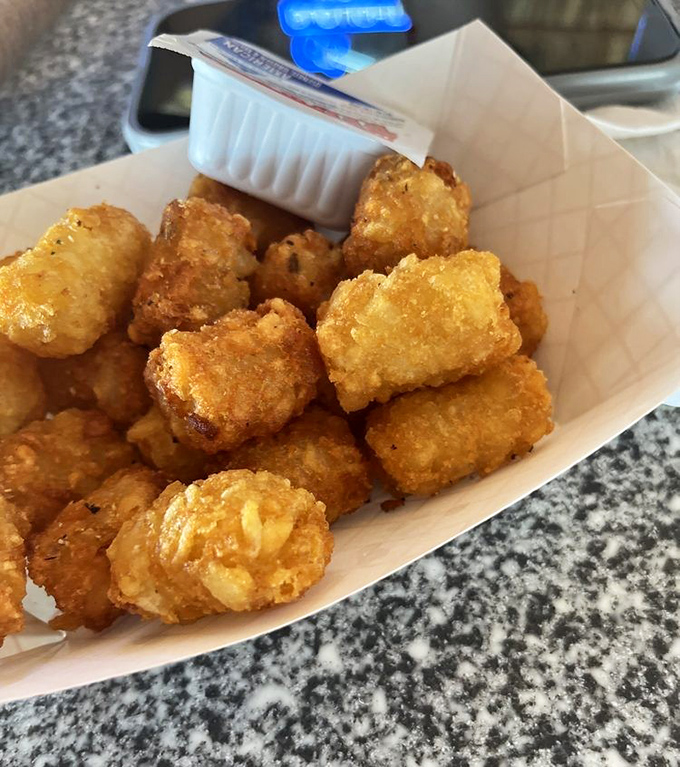 These golden-brown tater tots achieve the impossible &ndash; crispy exteriors giving way to fluffy potato centers that beg for one more dip.