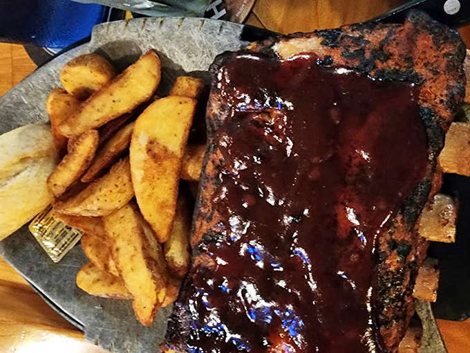 Glistening ribs slathered in tangy sauce &ndash; the kind of messy, delicious meal that creates lasting memories and stained napkins.