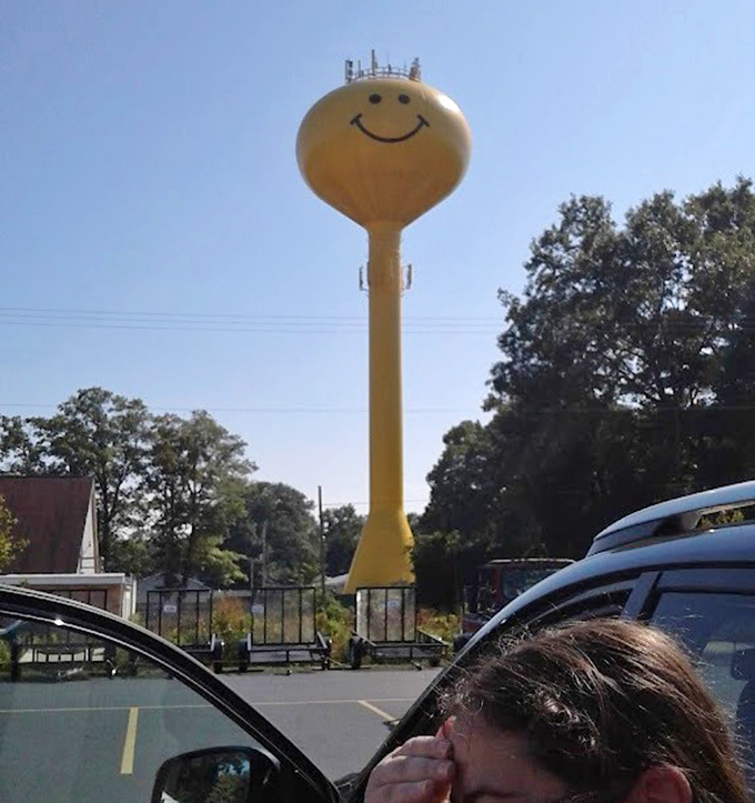 From nearby parking areas, the tower looms large &ndash; impossible to photograph without smiling back, as if caught in a friendly staring contest.