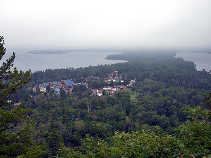 Copper Harbor nestles between forest and water, a tiny civilization dwarfed by nature's grandeur when viewed from mountain heights.
