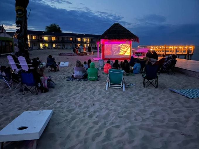 Movie night under the stars transforms the beach into nature's theater, complete with sand between your toes.