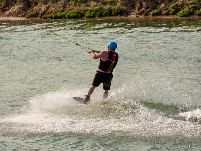 Wakeboarding thrills for the adventurous soul – part extreme sport, part peaceful glide across Michigan waters, all parts unforgettable experience.