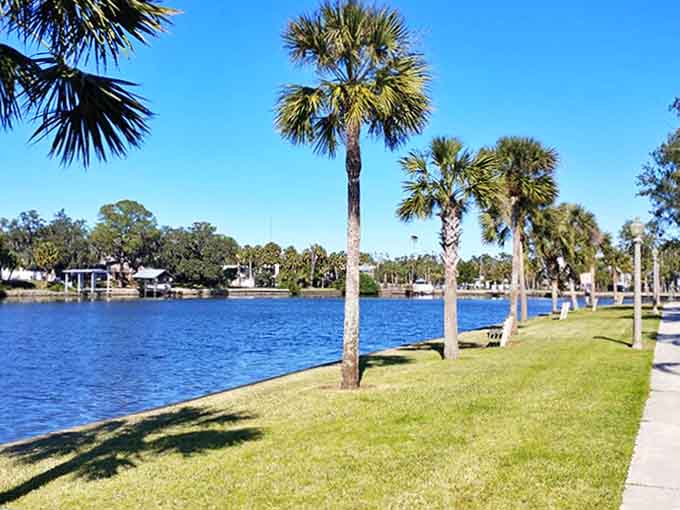 The waterside walking path invites leisurely strolls where pelicans dive-bomb for lunch and gentle breezes carry away your worries.