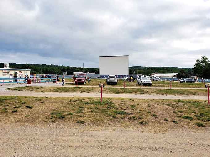 Cars arrange themselves like puzzle pieces, each finding the perfect angle. The communal experience begins as engines quiet.