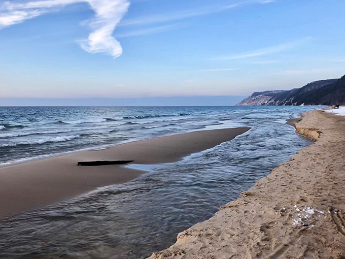 Winter's quiet transformation blankets the shoreline in serene solitude, revealing a completely different personality of this beloved beach.