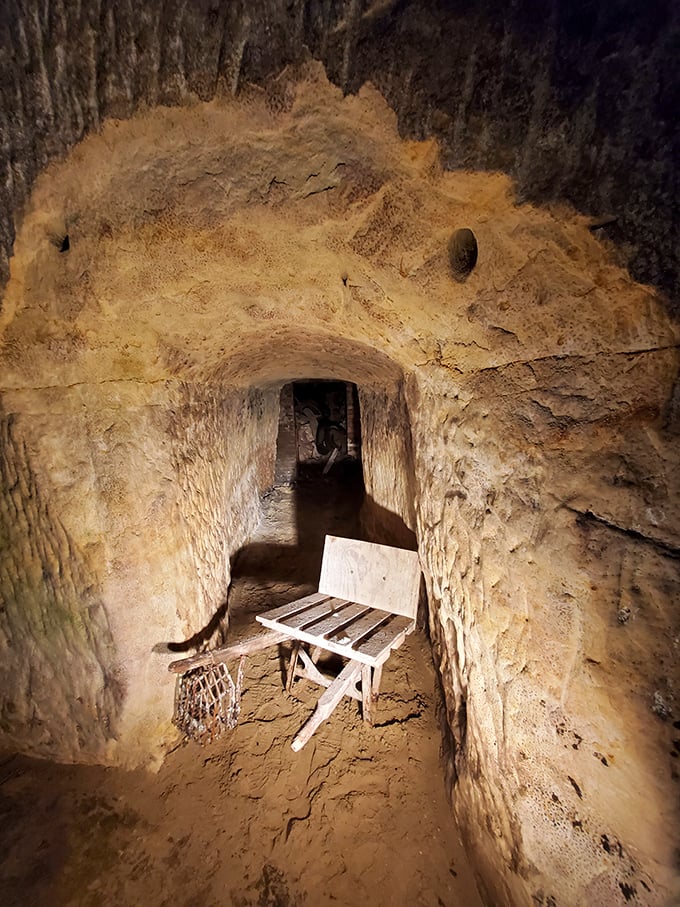 An antique wheelbarrow reminds visitors that these caves started as working mines before becoming the coolest nightclub in town.