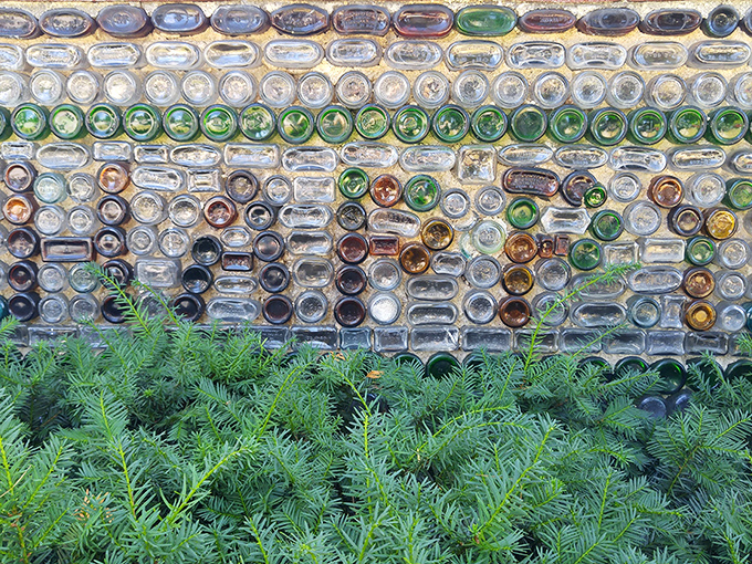 Sunlight plays through the bottle bottoms creating an ever-changing mosaic &ndash; functional architecture transformed into accidental art that shifts with the day's light.