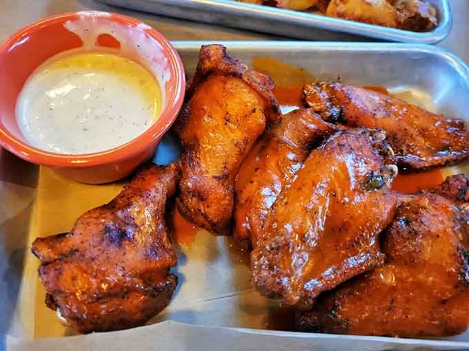 Chicken Wings: Glistening wings with a side of creamy dipping sauce &ndash; these aren't just appetizers, they're the opening act to a symphony of flavors.