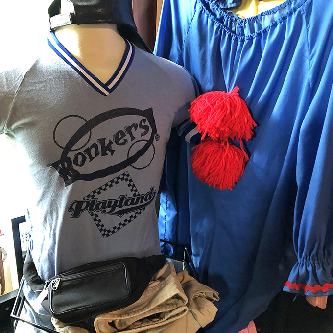 Nostalgia with an edge &ndash; a vintage Bookers Playland shirt hangs alongside other clothing artifacts from Michigan's past.