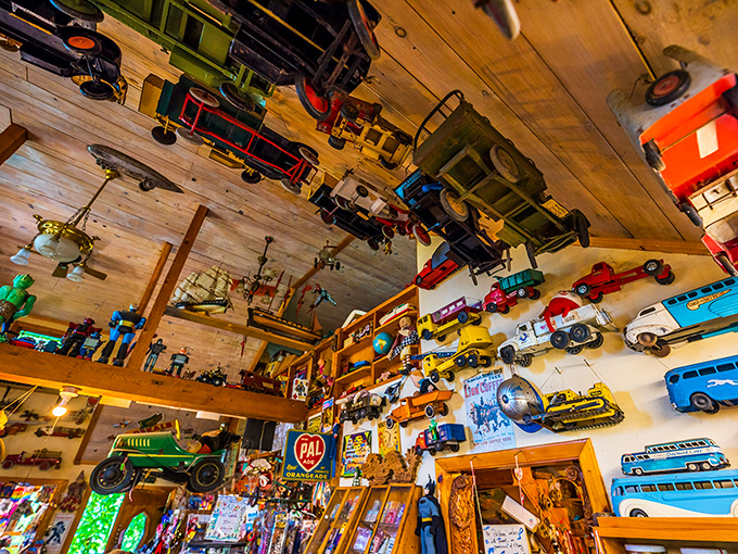 Vintage toy cars, trucks and planes create a traffic jam of nostalgia along the walls, each vehicle carrying passengers of memory to different decades.