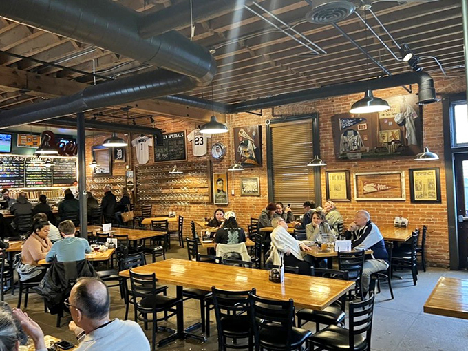 The dining room buzzes with the comfortable energy of a seventh-inning stretch &ndash; relaxed yet expectant, knowing something good is coming soon.