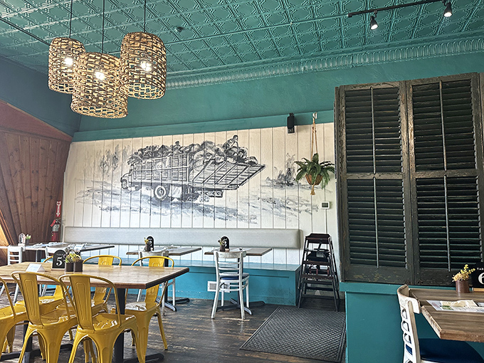 Aqua walls and tropical patterns create an underwater paradise vibe that makes everyday Michigan feel miles away from this dining sanctuary.